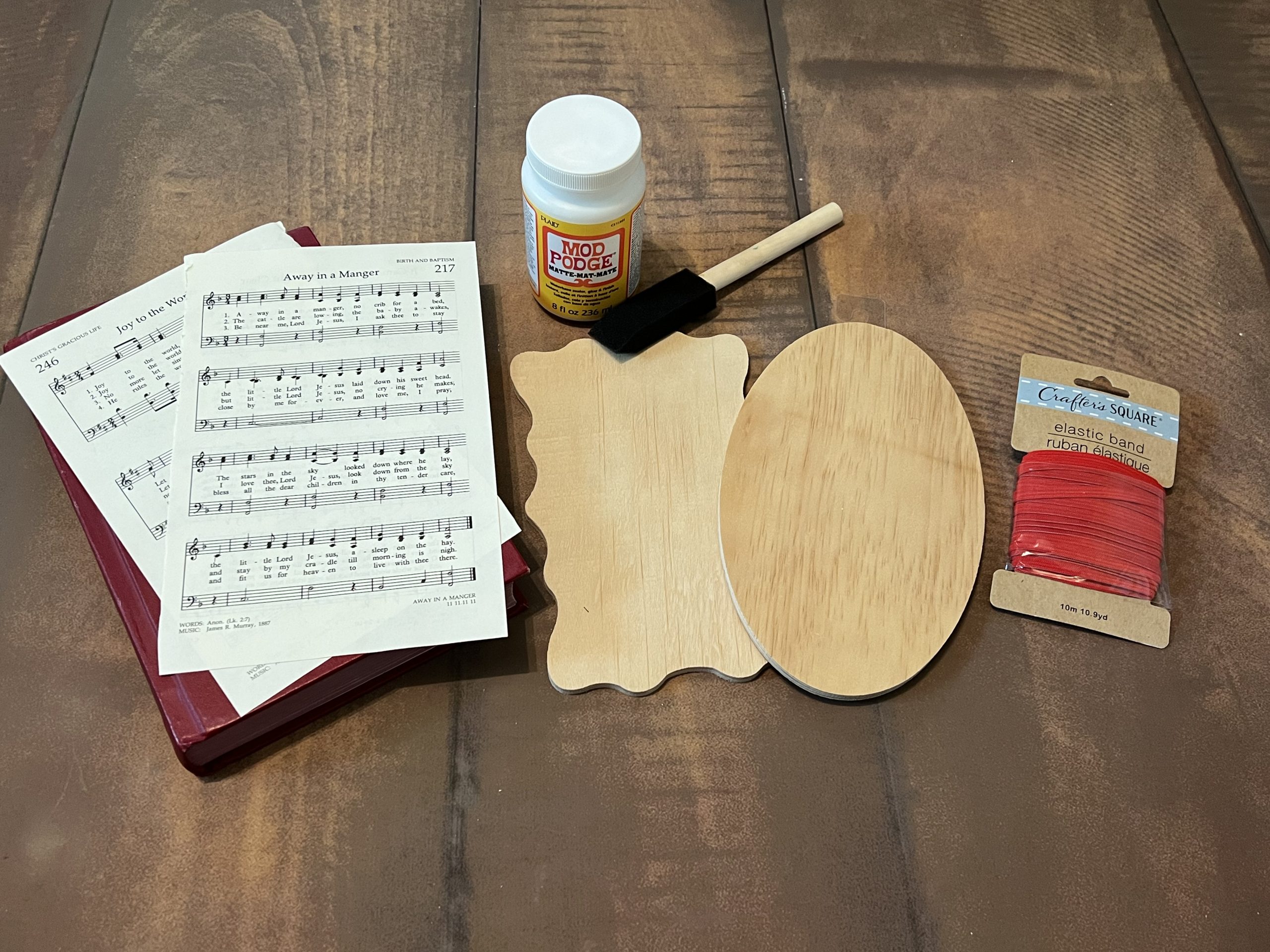 how to mod podge christmas hymns to create ornaments - Re-Fabbed