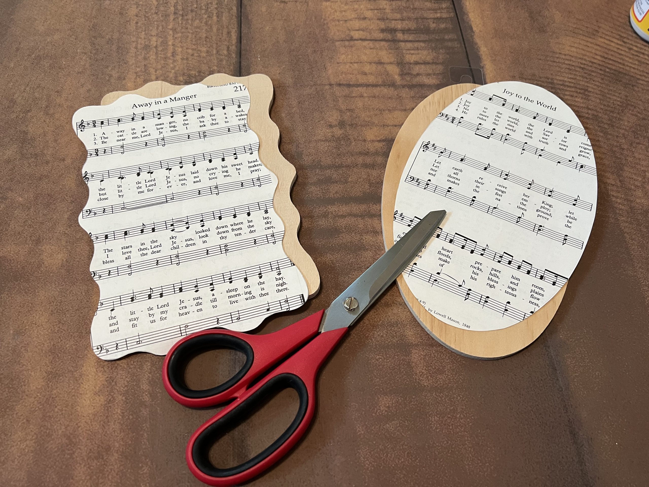 how to mod podge christmas hymns to create ornaments - Re-Fabbed