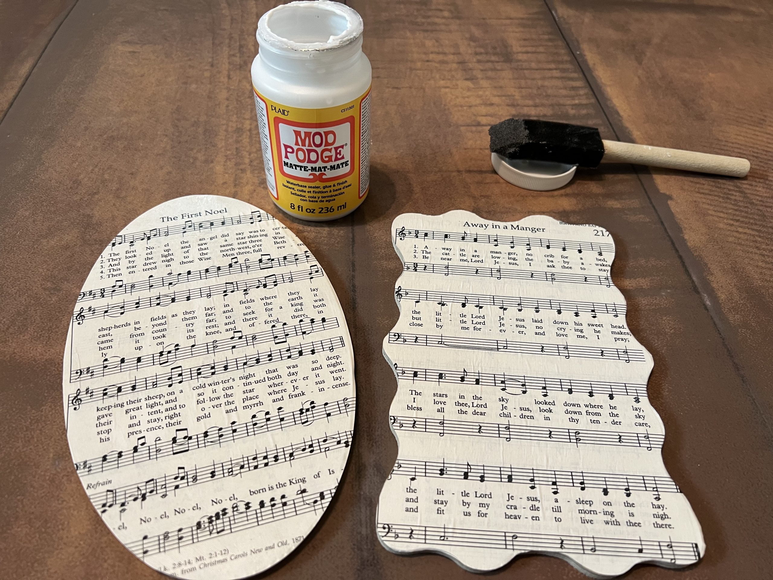 how to mod podge christmas hymns to create ornaments - Re-Fabbed