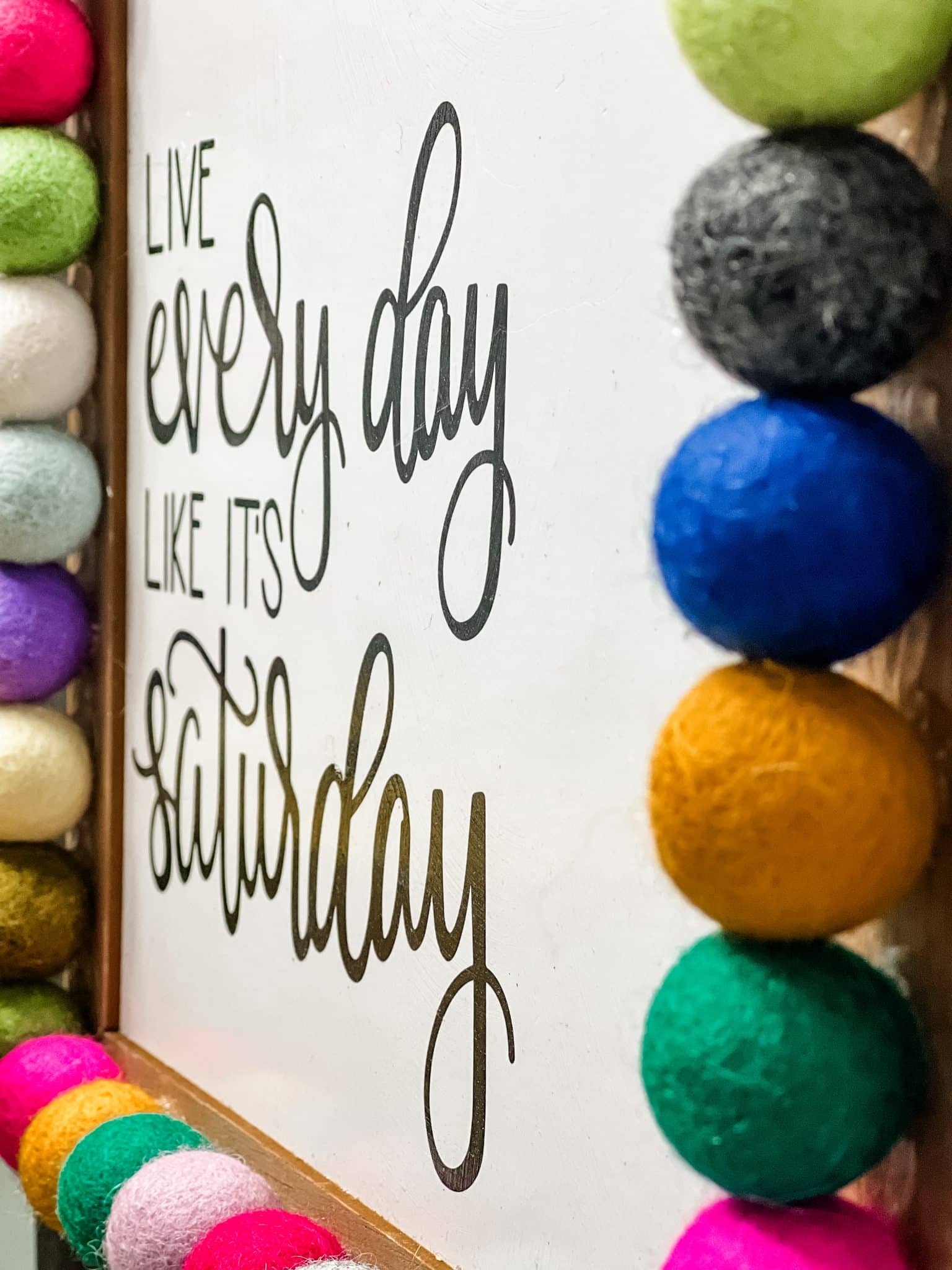 dollar general sign makeover with felt balls - Re-Fabbed